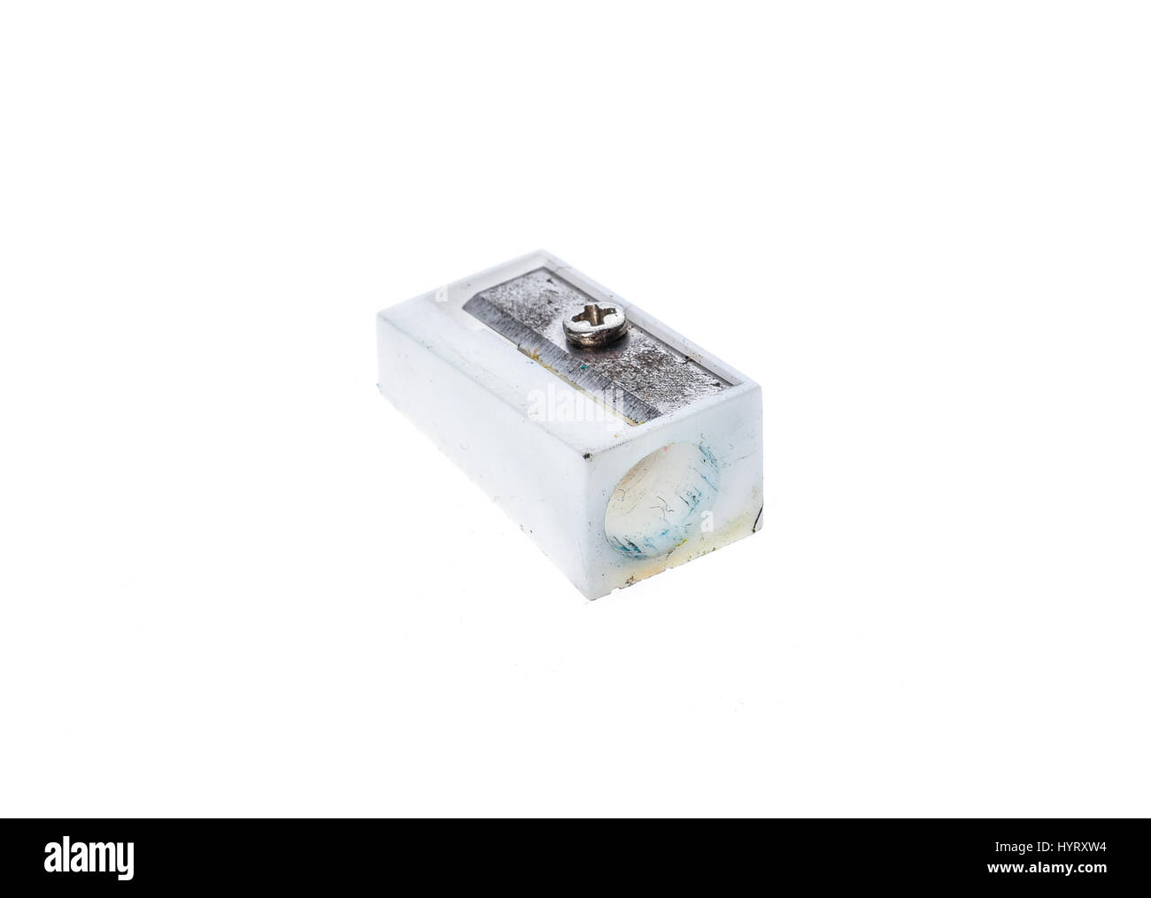 Old used white plastic pencil sharpener isolated on white. One hole ...