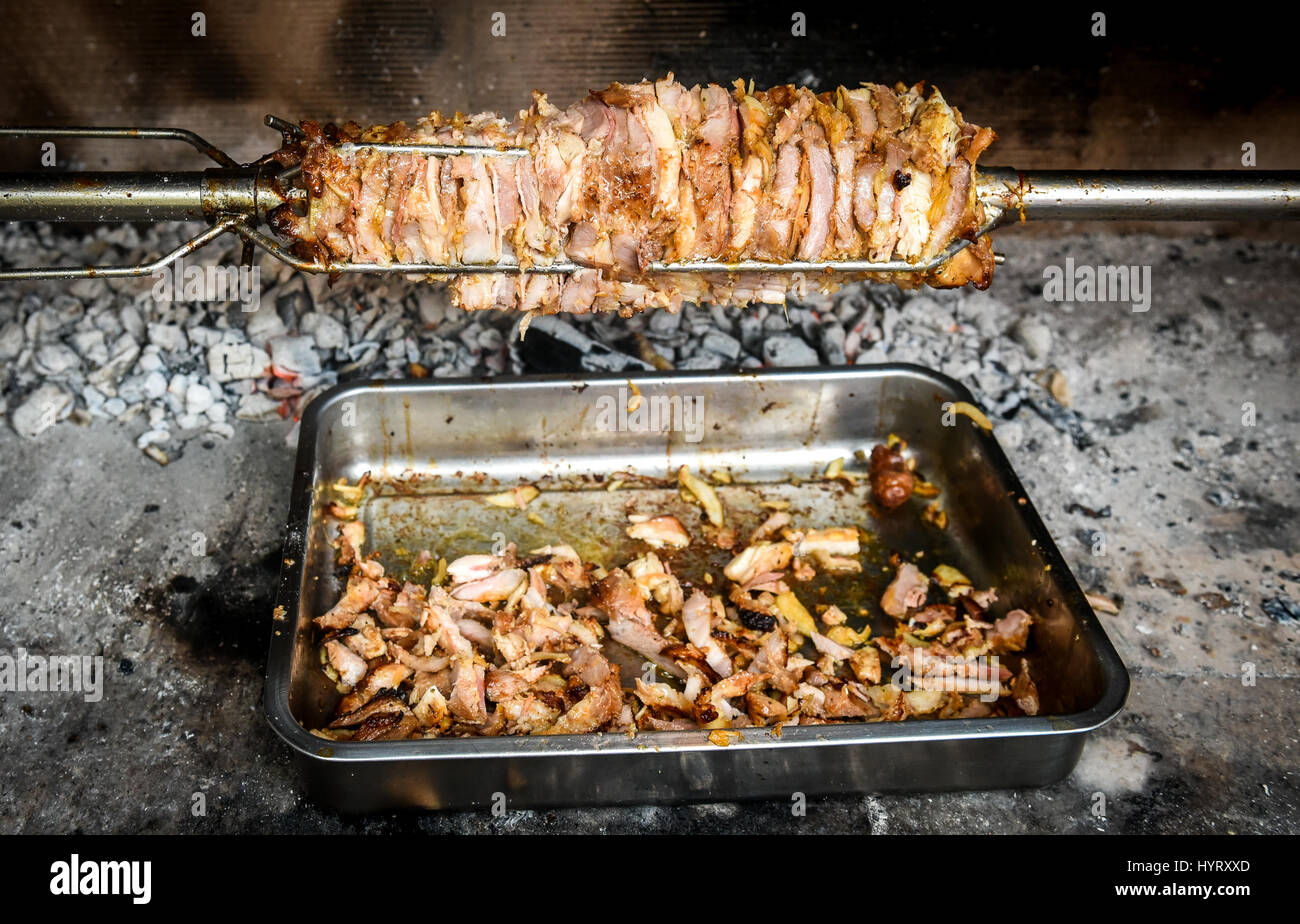 Making home made cag kebab gyros with fire and charcoal. Cağ or döner ...