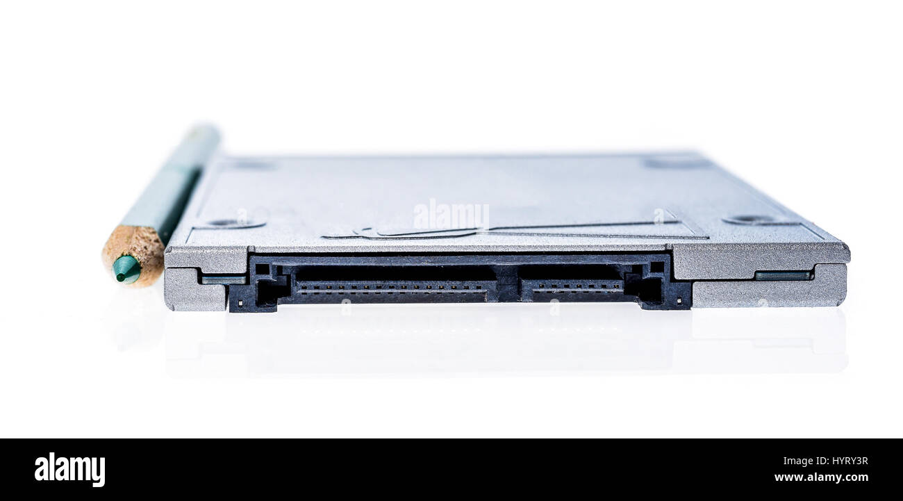 Solid state drive SSD next to a pencil size comparison. SATA - data and ...