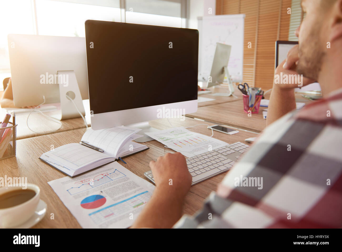 Man working in front of the computer Stock Photo - Alamy