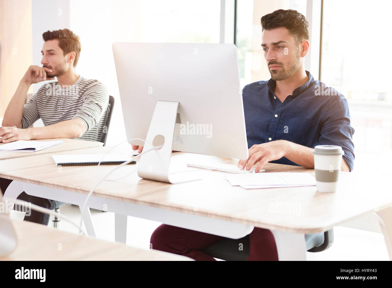 Men focused on their work Stock Photo - Alamy