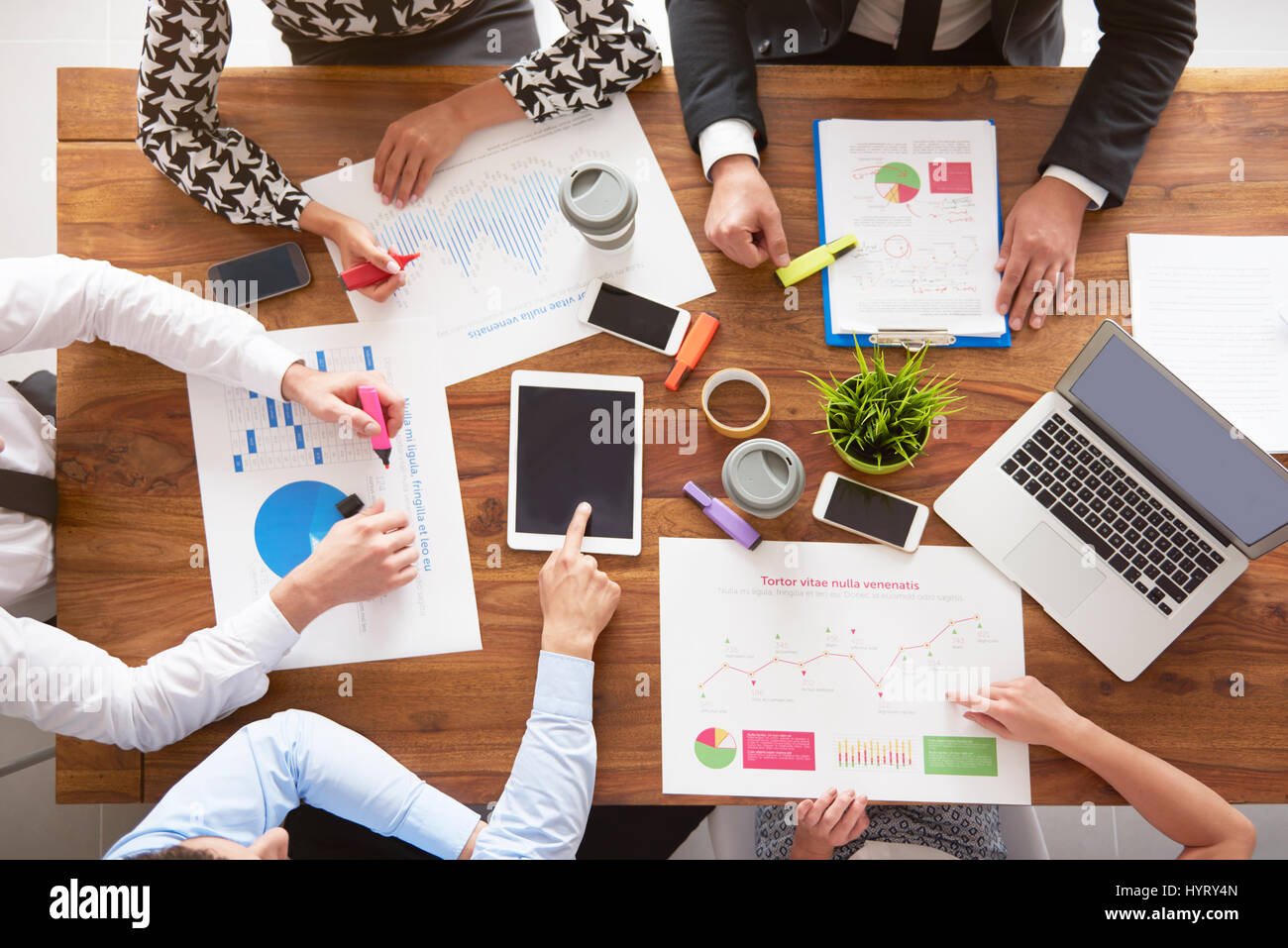 Business people sitting around table hi-res stock photography and ...