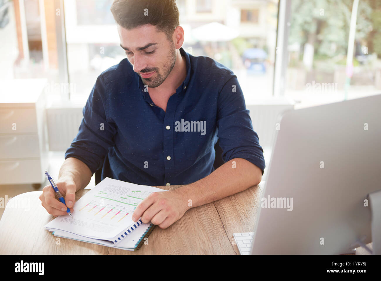 Man writing some important documents Stock Photo - Alamy