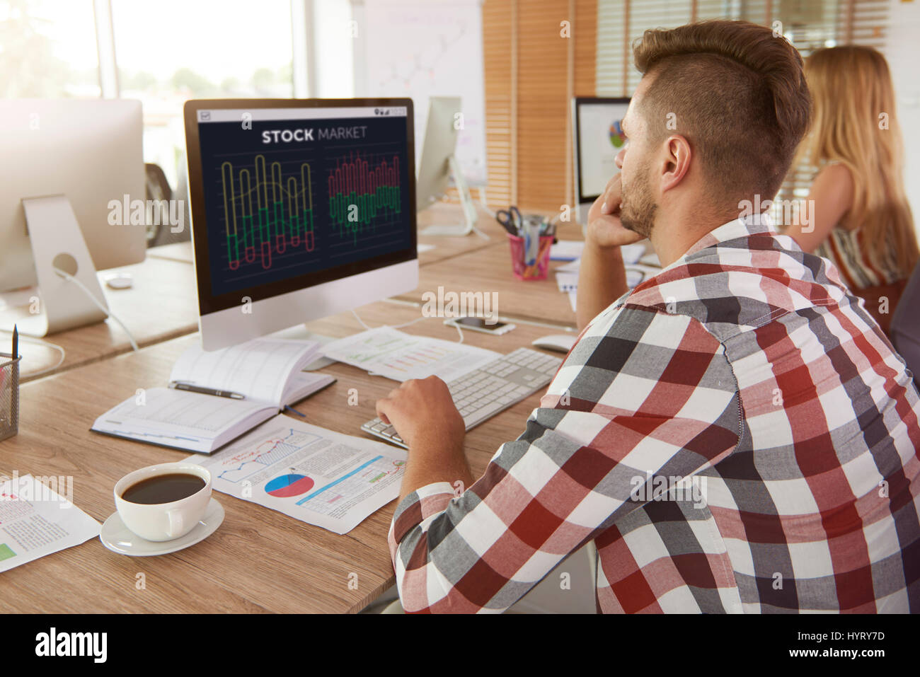 Man analyzing some data on computer Stock Photo - Alamy
