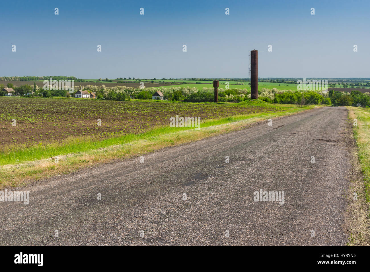 Spring landscape with rural road to remote Ukrainian village at spring ...