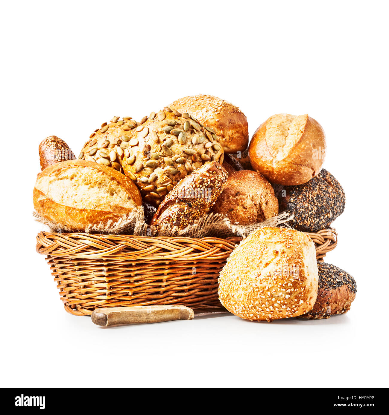 Basket of various bread rolls and buns isolated on white background ...