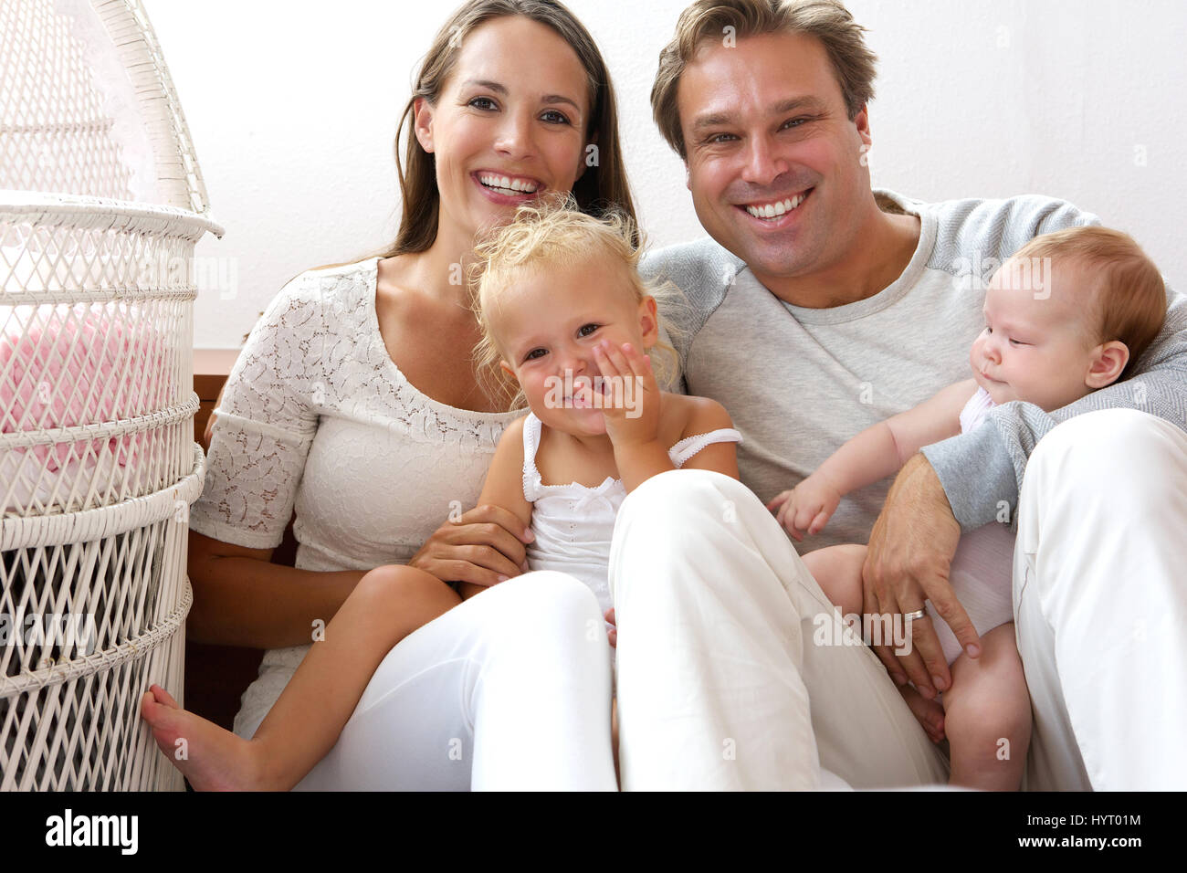 Close up portrait of a happy family smiling with baby Stock Photo - Alamy