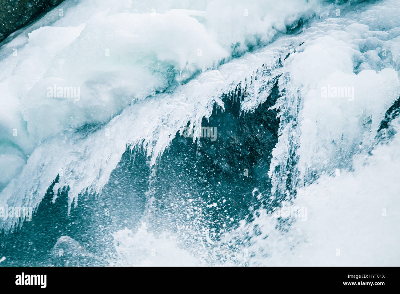 A beautiful ice formations along the frozen river in Norwegian winter ...