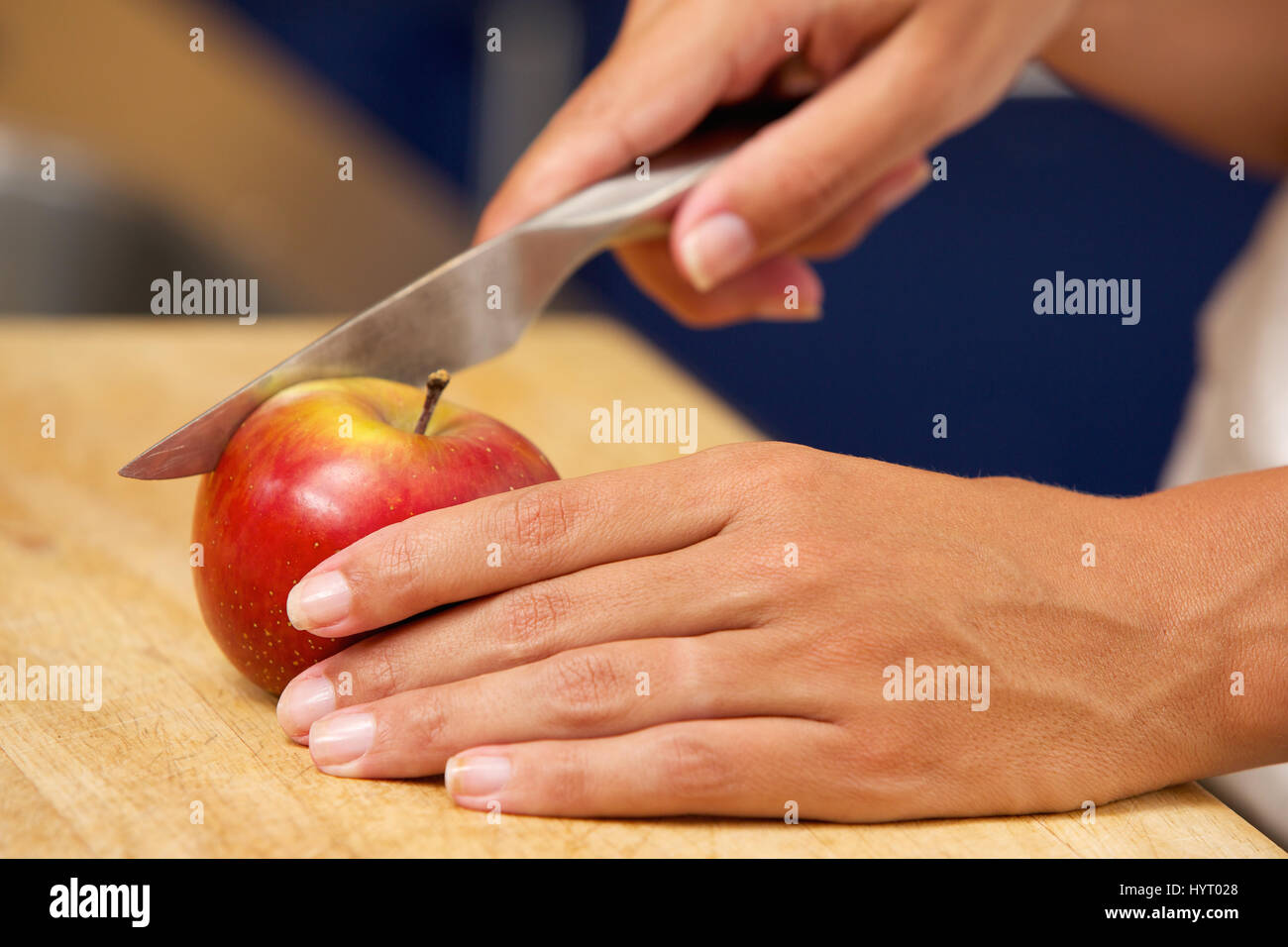 Close up female hands cutting apple with knife Stock Photo - Alamy
