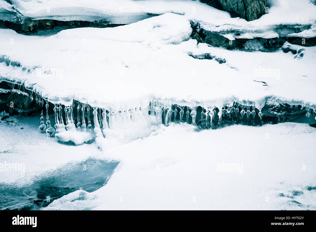 A beautiful ice formations along the frozen river in Norwegian winter ...