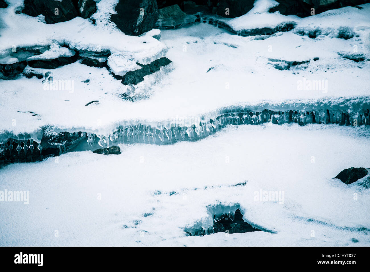 A beautiful ice formations along the frozen river in Norwegian winter ...