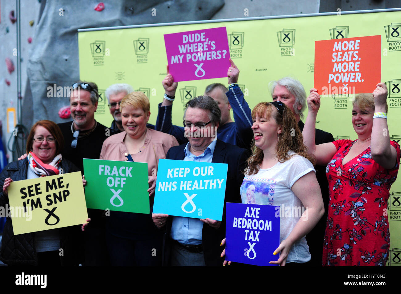 A group of supporters hold up placards with SNP slogans at the launch ...