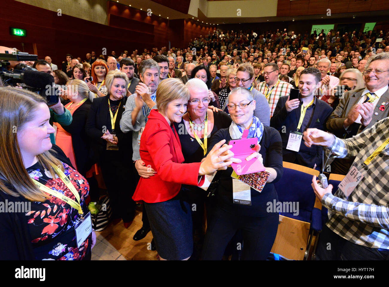 Newly-elected SNP leader Nicola Sturgeon (in red) poses for a selfie ...