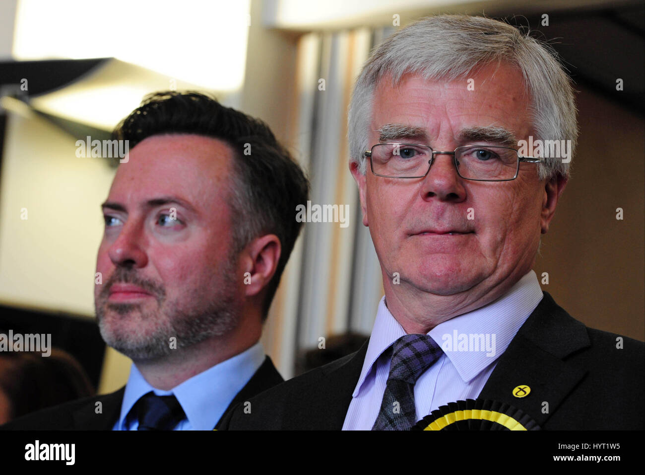 The SNP's Ian Hudghton (R), with Alyn Smith in the background, the ...