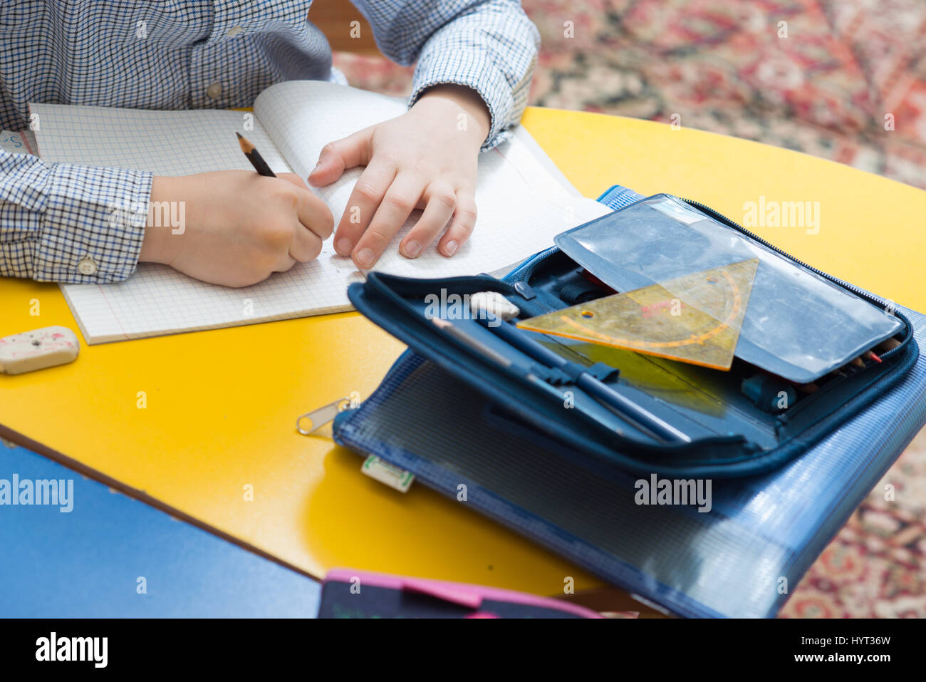 Children on the writting lesson at school with their school supplies ...