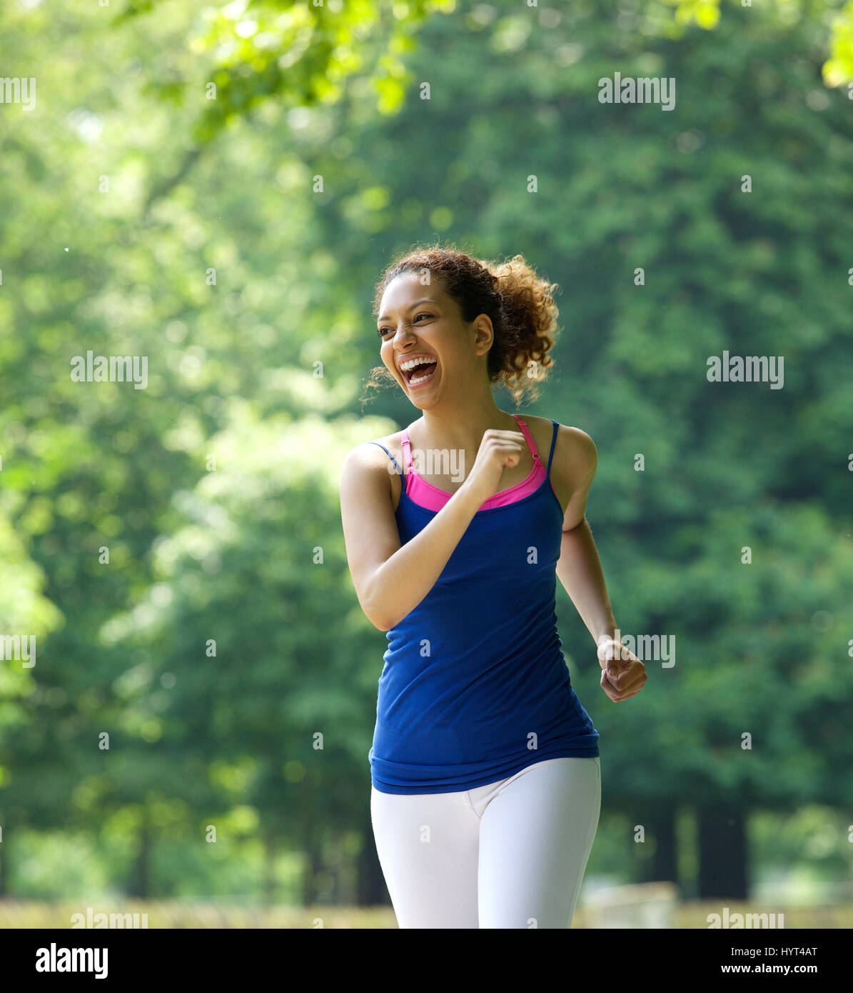 Lady jogging in the park hi-res stock photography and images - Alamy