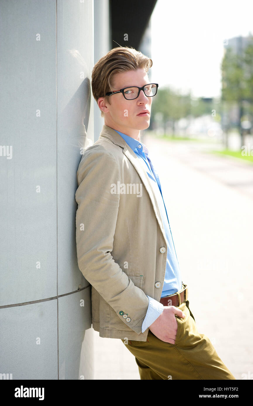 Portrait of a male fashion model posing outdoors Stock Photo - Alamy