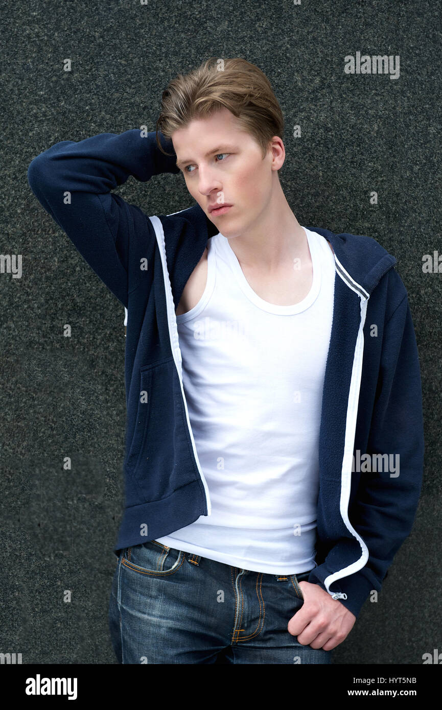 Portrait of a male fashion model posing with hand in hair Stock Photo ...