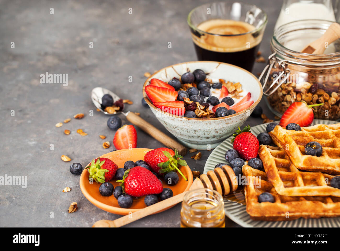 Healthy breakfast table with cereal granola, milk, fresh berries ...