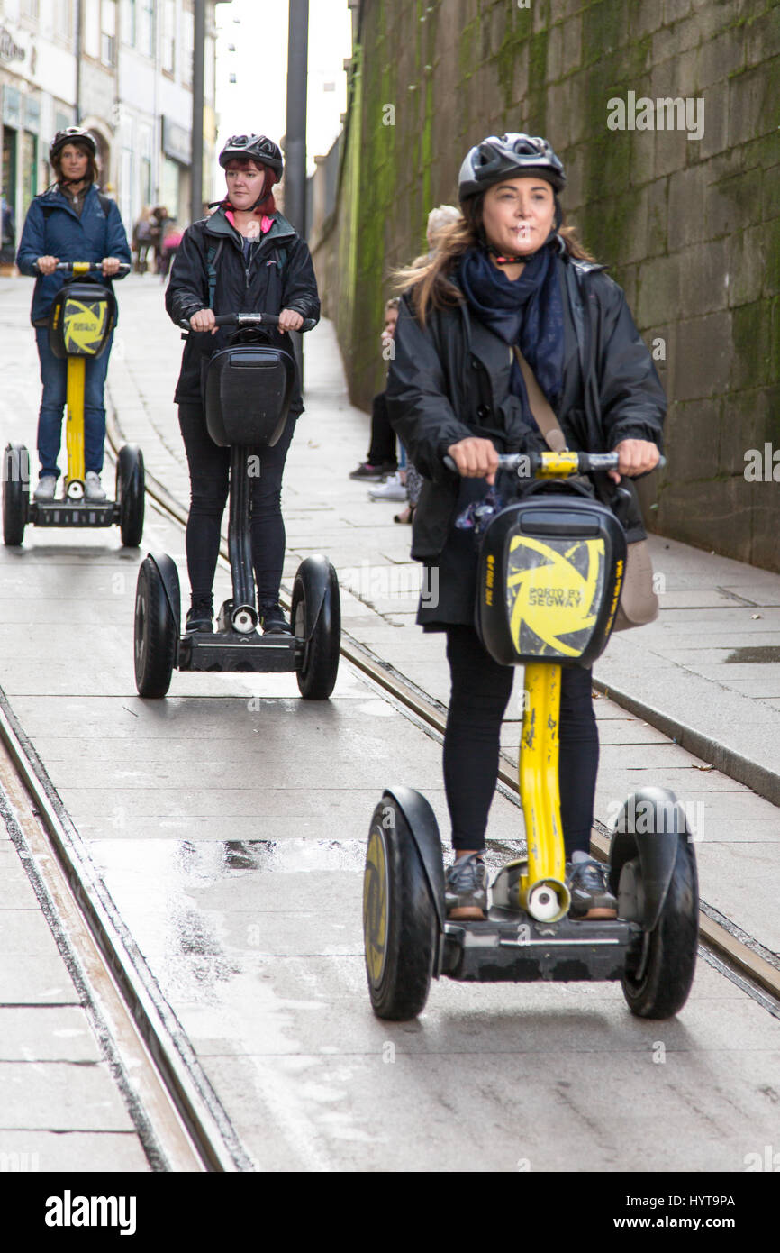 Real candid women having city tour on segways in Porto, Portugal ...