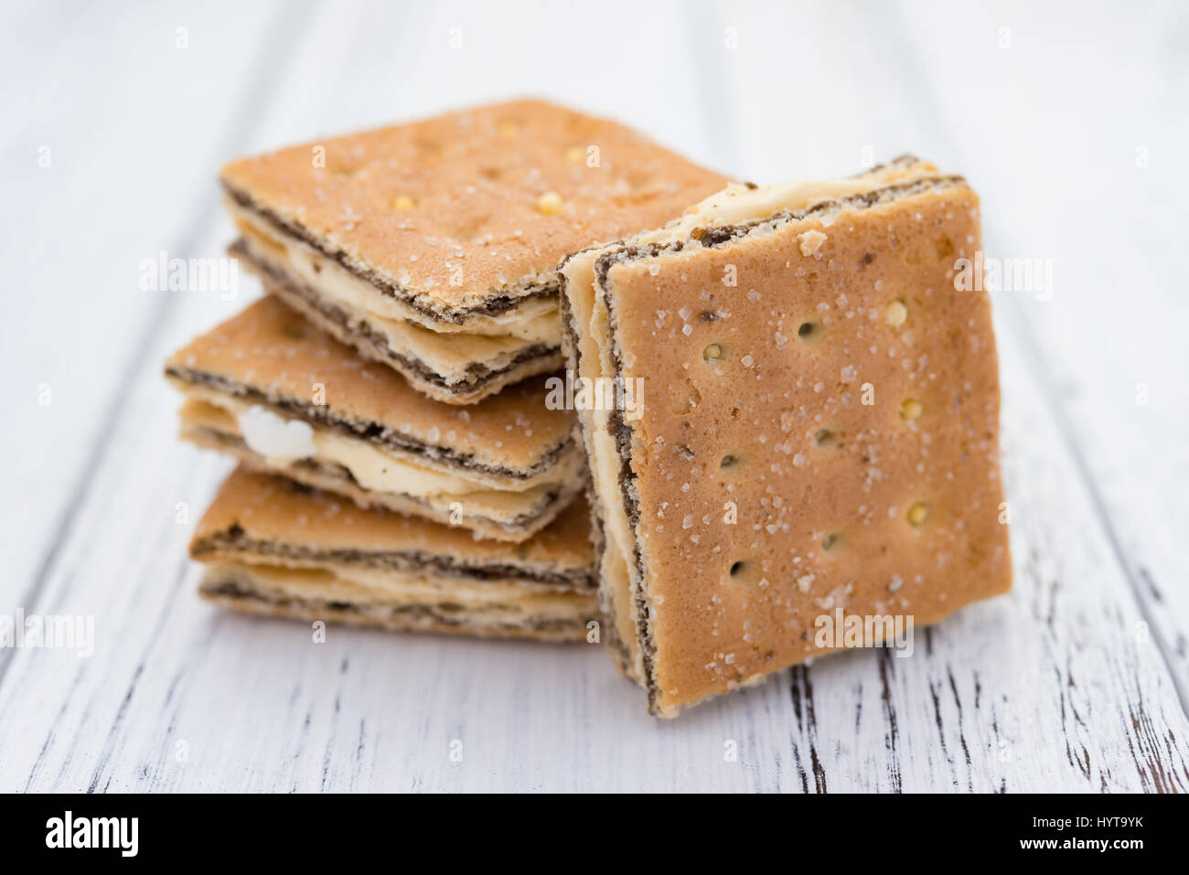 square shape sandwich biscuits a white wood background Stock Photo - Alamy