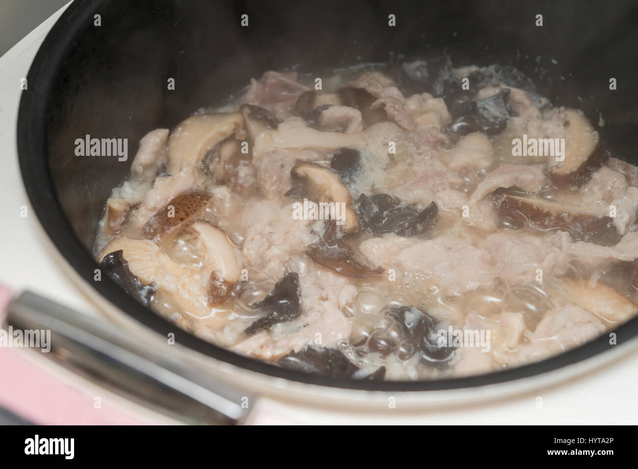 cooking rice with pork mushroom and black fungus by electric rice ...
