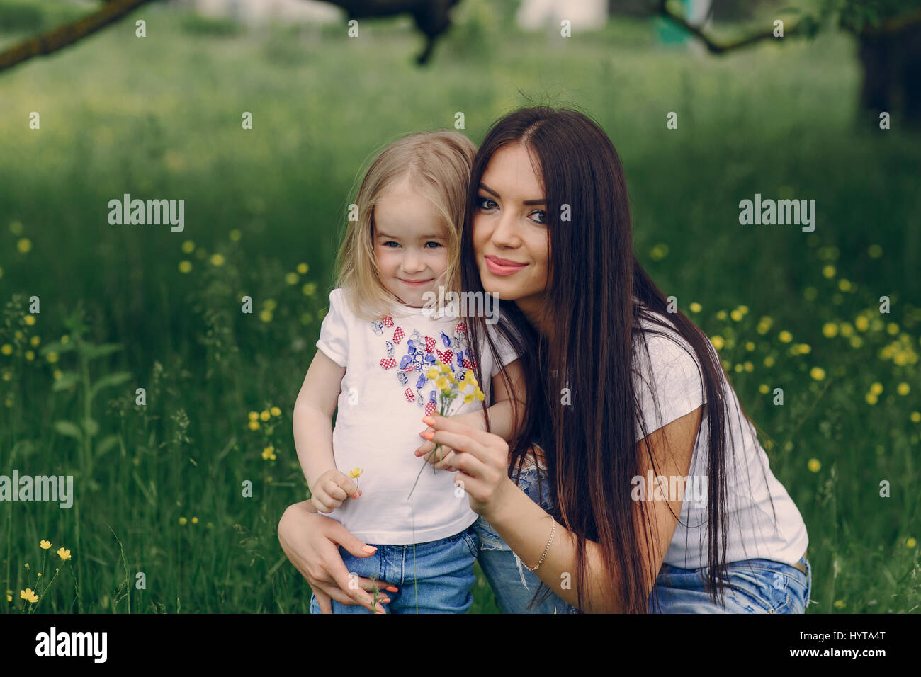 child near tree with mom Stock Photo - Alamy