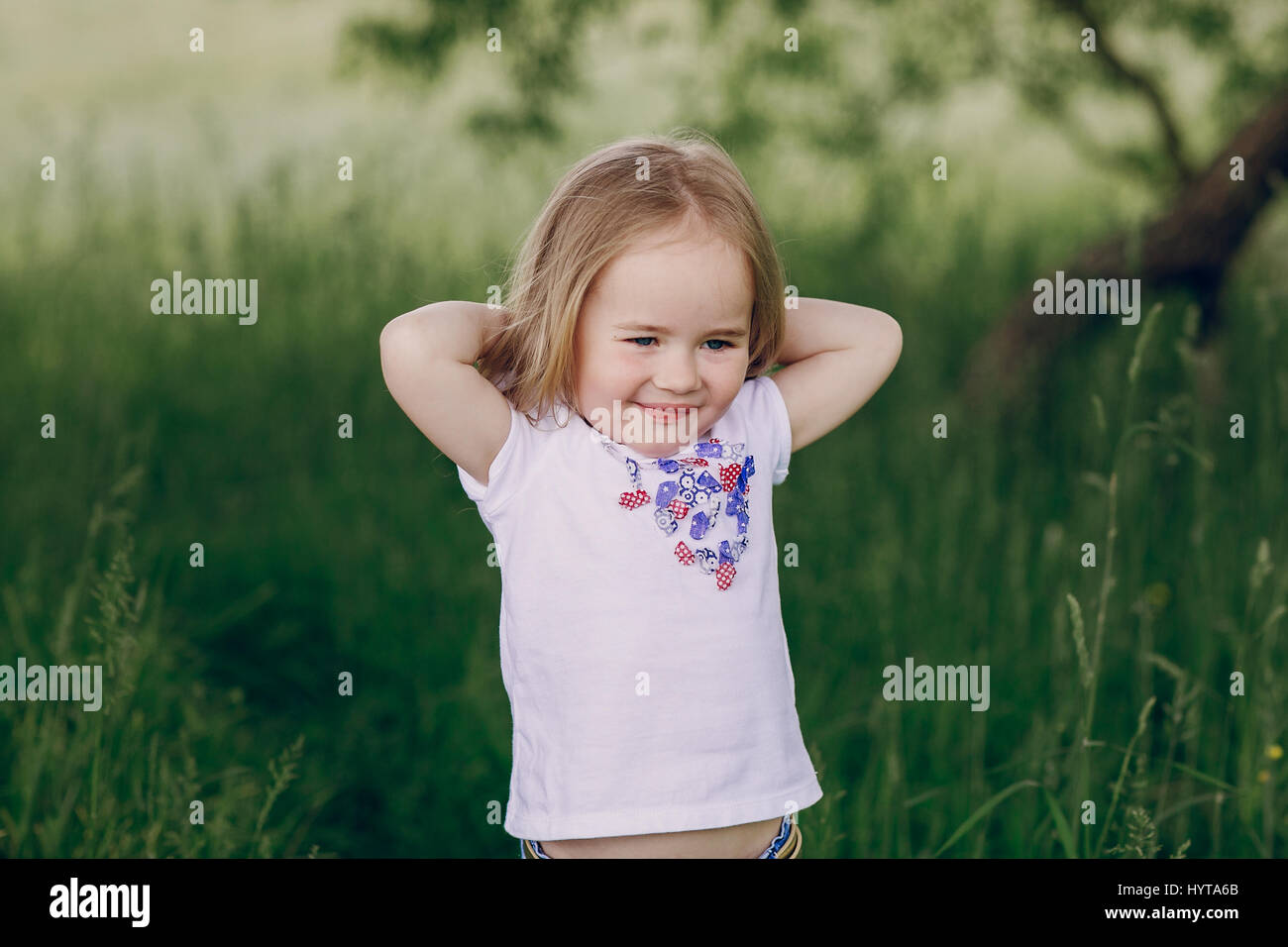 child near tree Stock Photo - Alamy