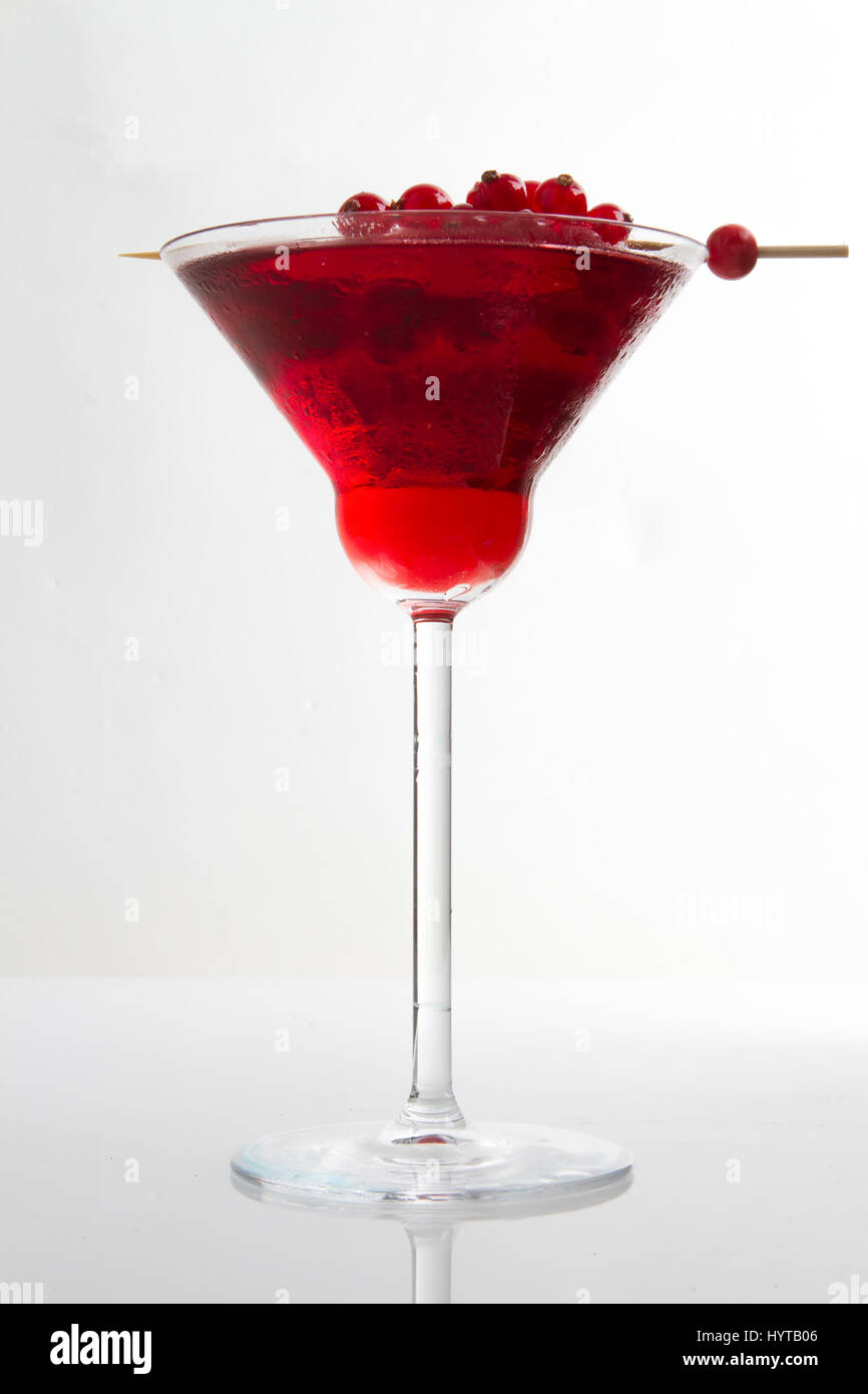 red cocktail in martini glass. martini cocktail on white background ...