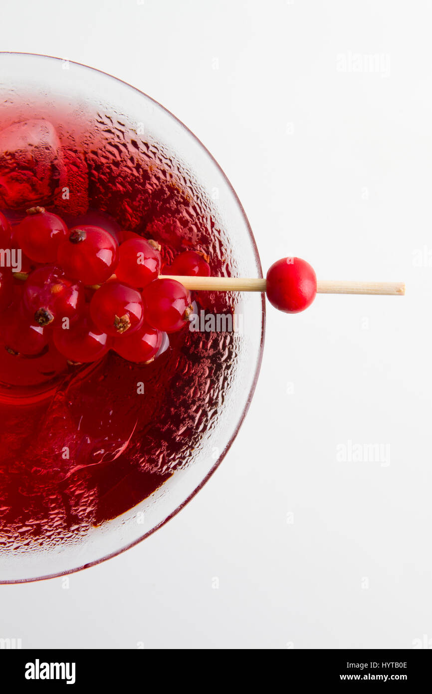 red cocktail with berry on white background. martini cocktail top view ...