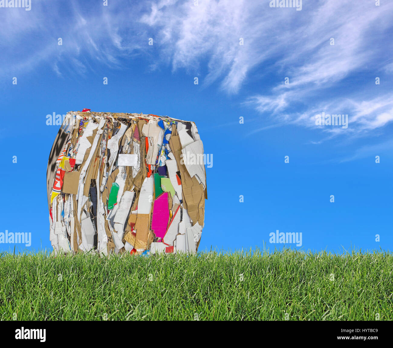 Pressed boxes made of paperboard on the meadow with blue sky in the ...