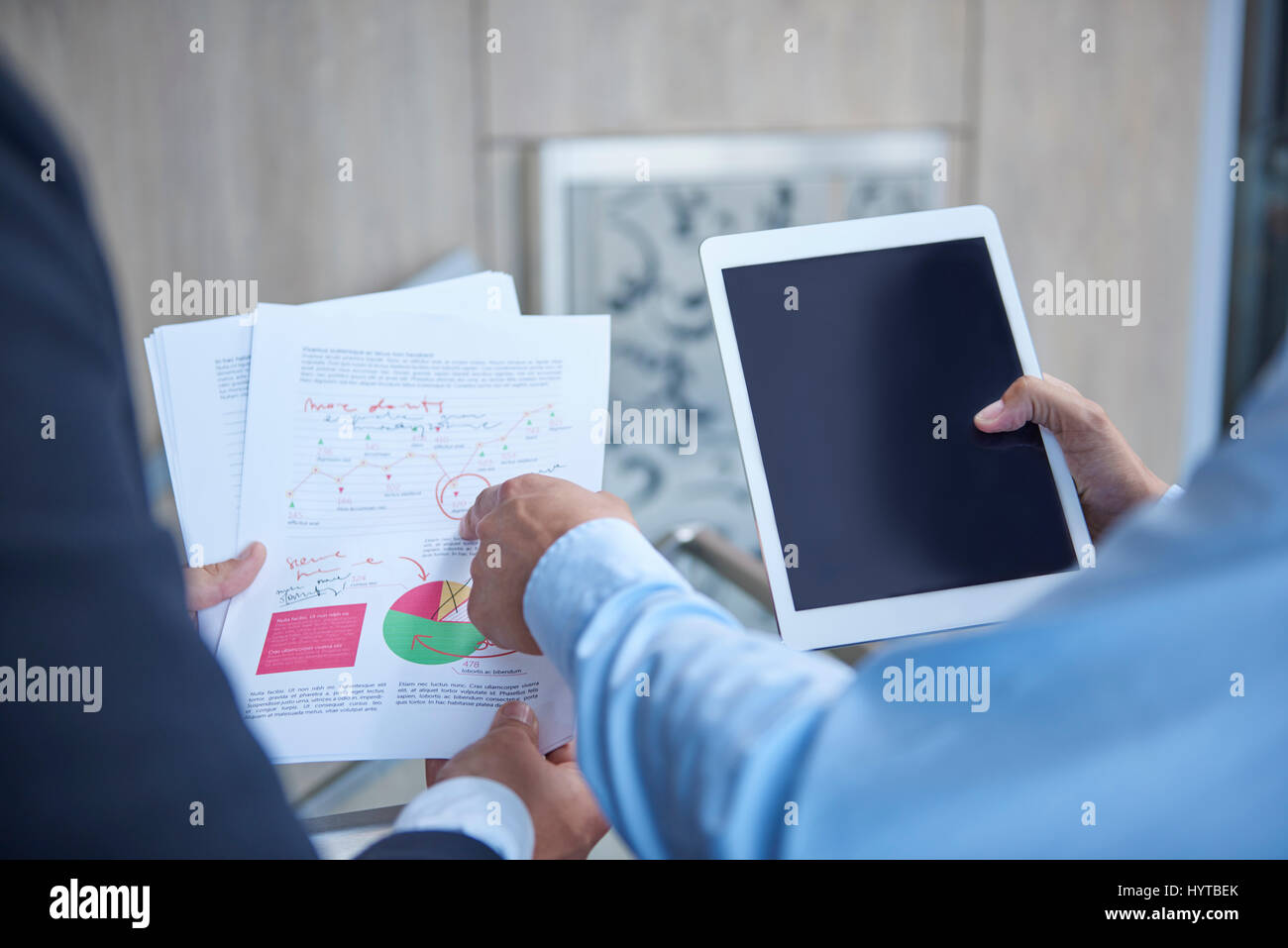 Men analyzing some important documents Stock Photo - Alamy