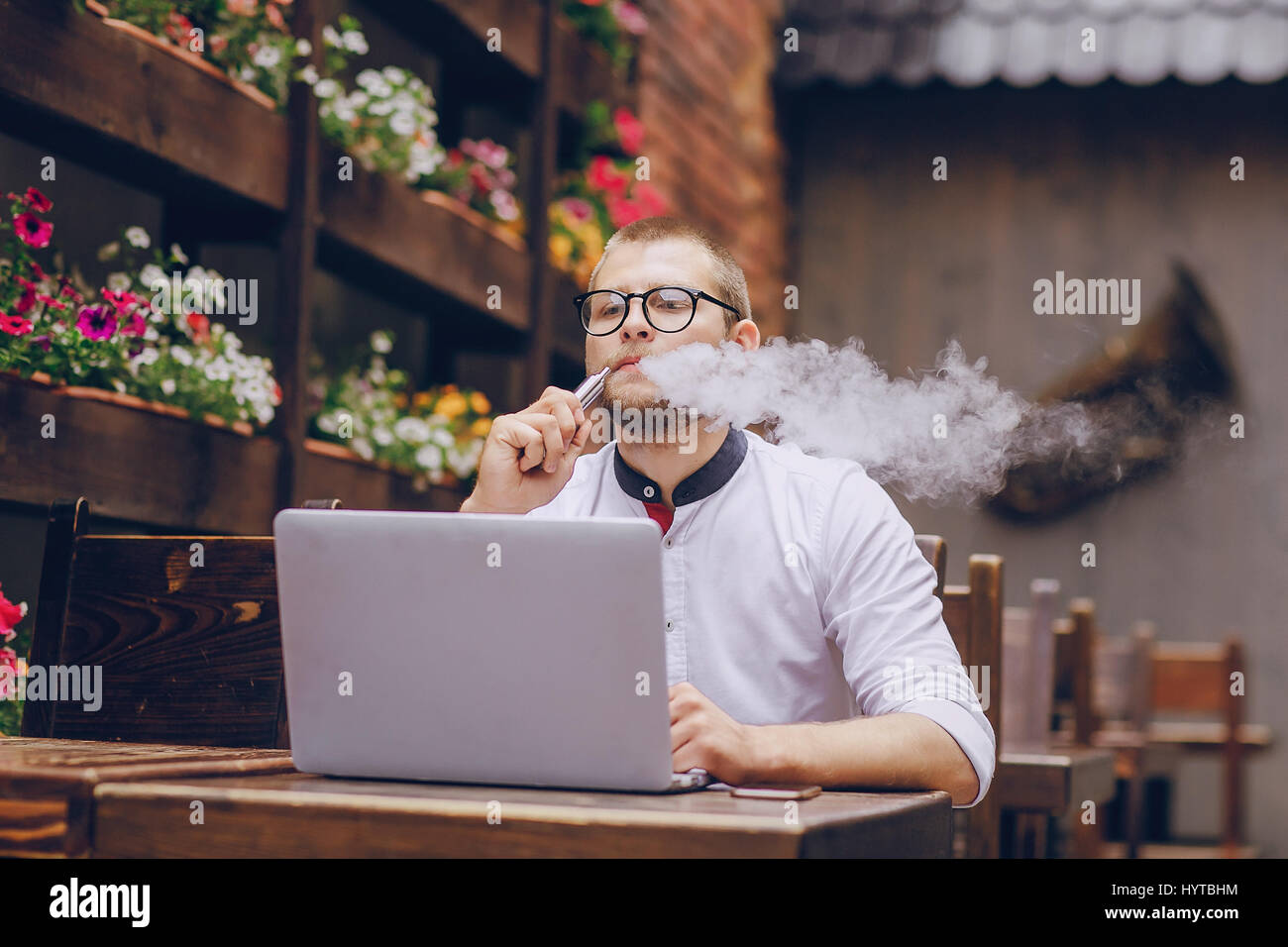 Man vaping in cafe hi-res stock photography and images - Alamy