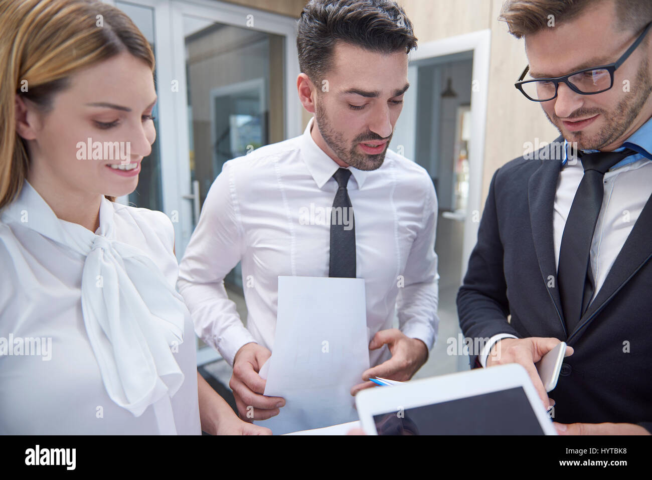 Three business people having a meeting hi-res stock photography and ...