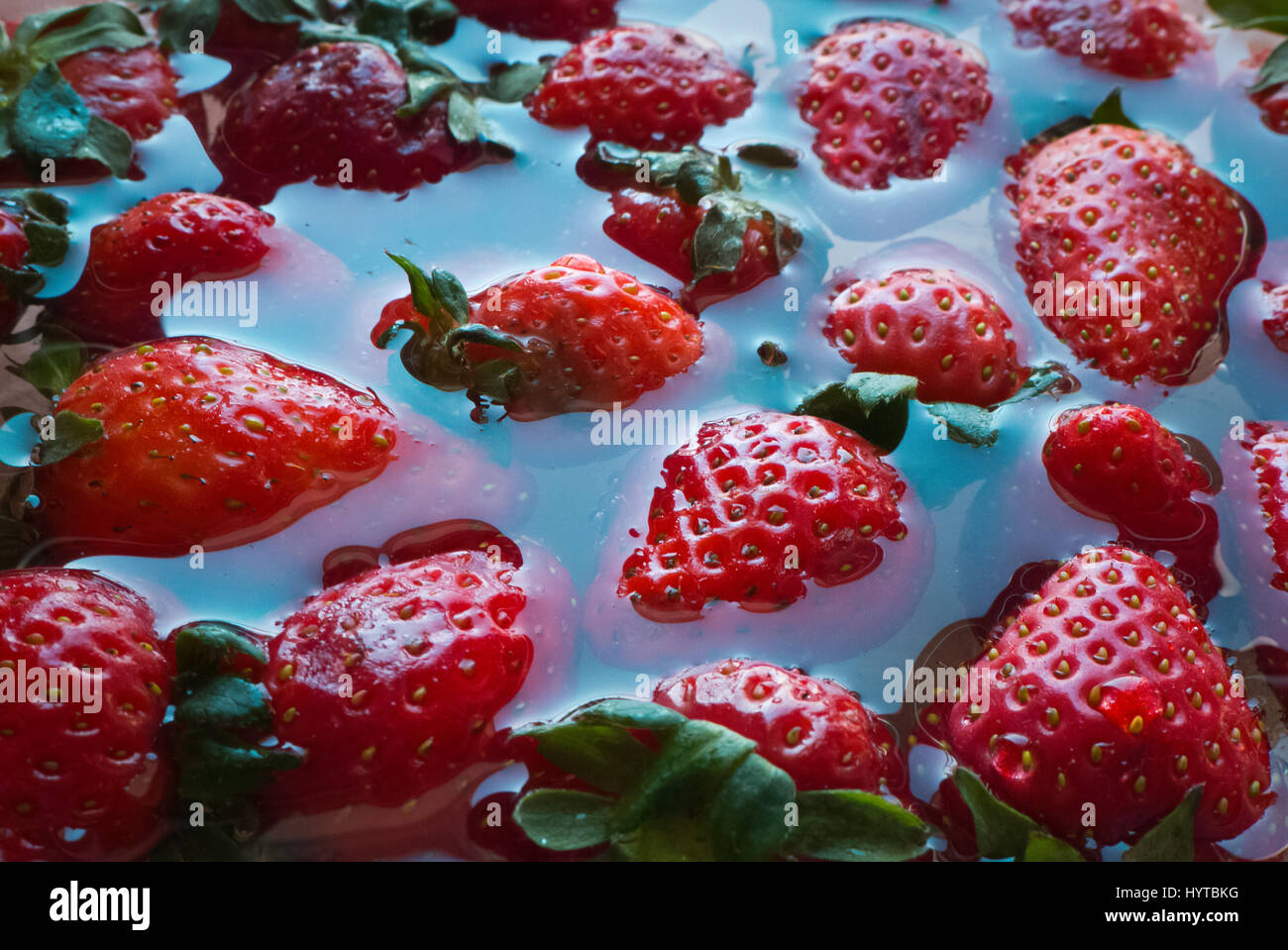 Strawberries in water Stock Photo - Alamy