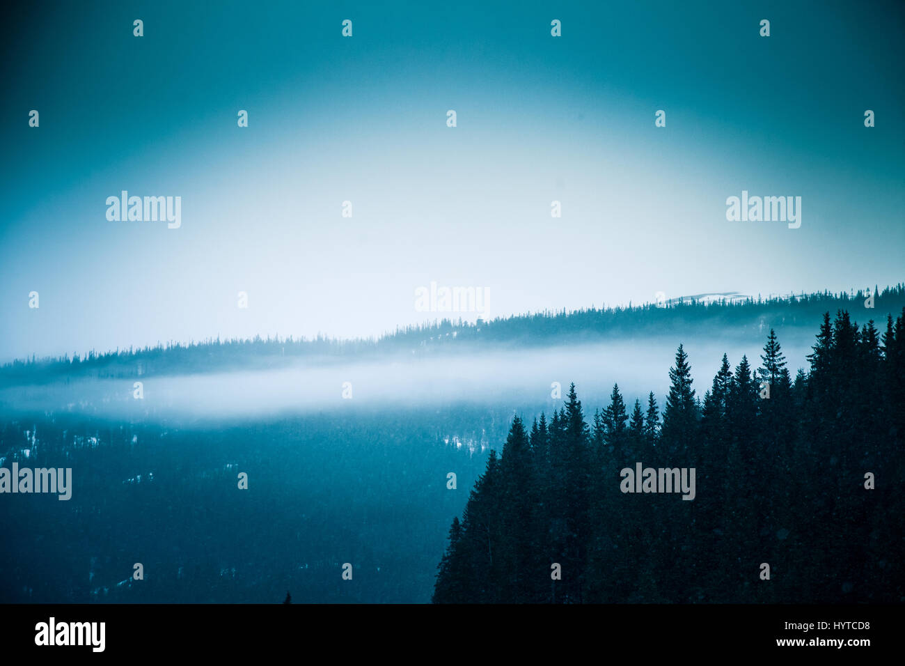 A beautiful, dramatic, colorful winter landscape with mountains in ...