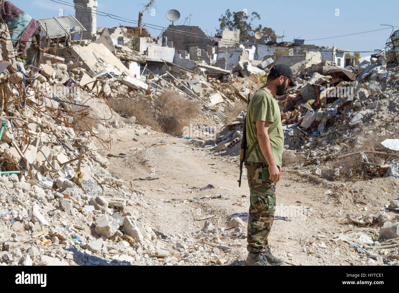 A soldier in destroyed Jobar suburb of Damascus Stock Photo - Alamy