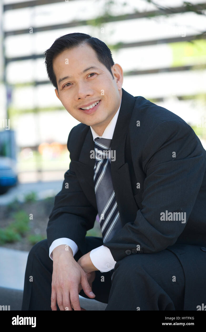 Portrait friendly chinese man sitting hi-res stock photography and ...