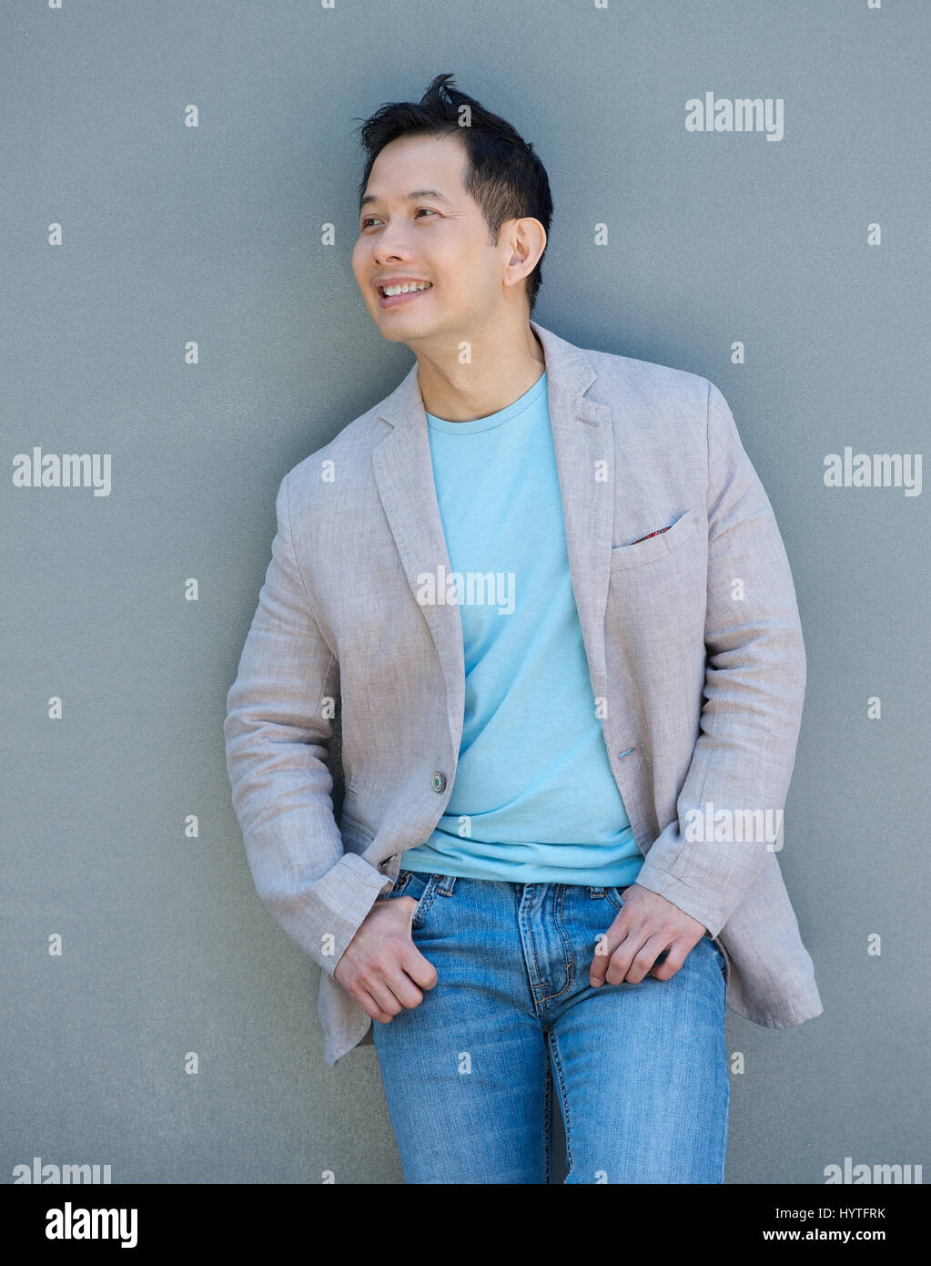 Portrait of a confident asian man smiling outdoors Stock Photo - Alamy