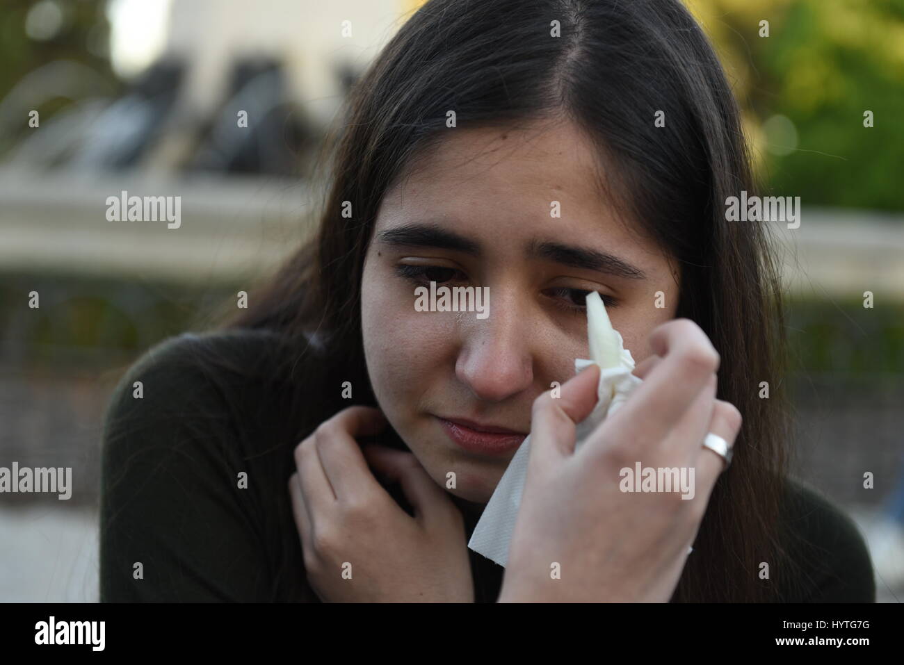 Madrid, Spain. 06th Apr, 2017. A woman tries to cry with a slice of ...