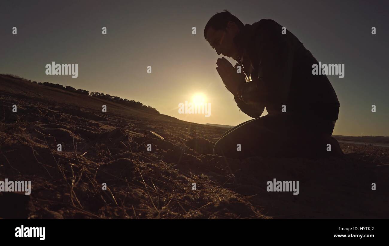 man praying god sunset sitting sun silhouette sunlight the religion ...
