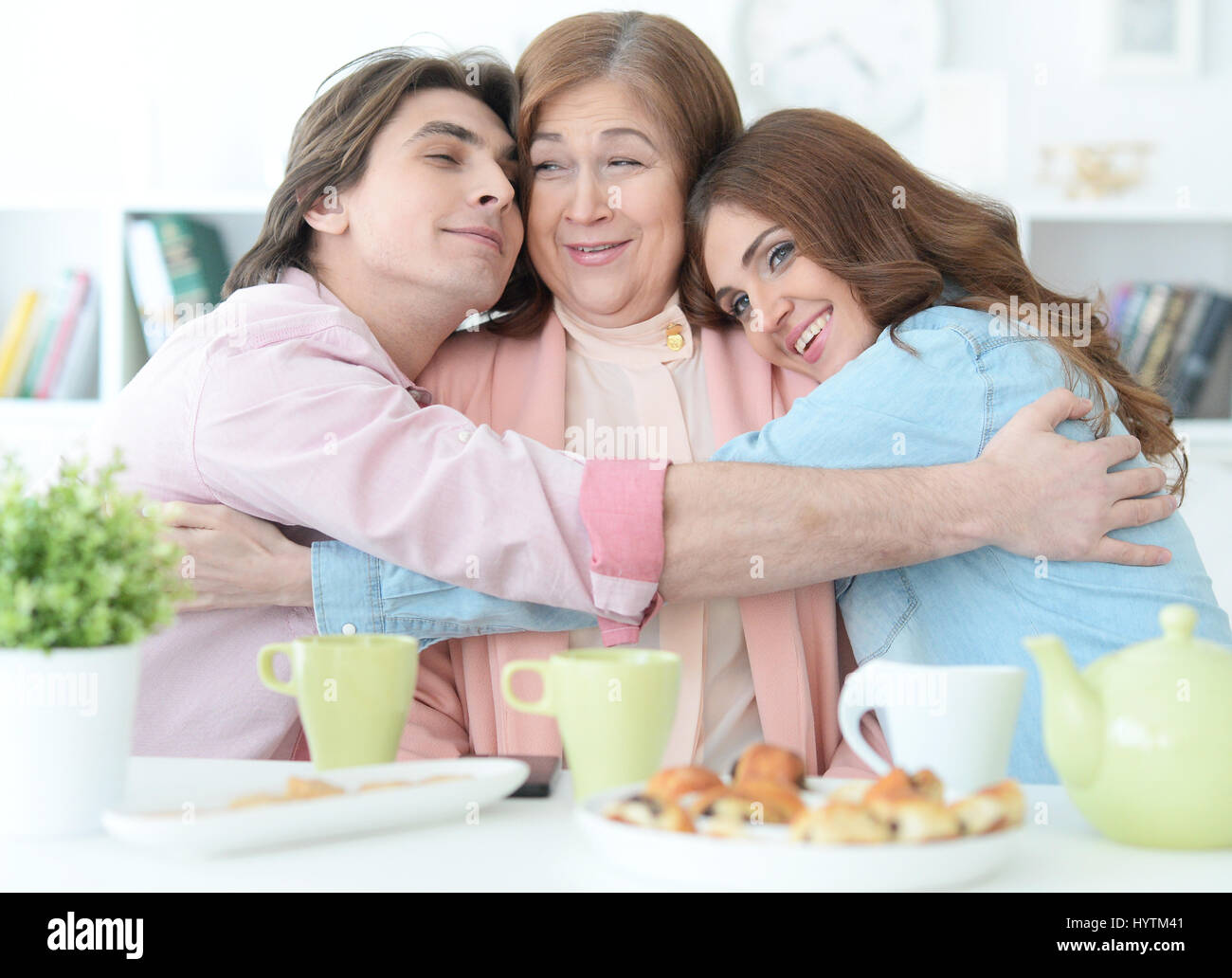 Portrait of a happy family drinking tea together Stock Photo - Alamy