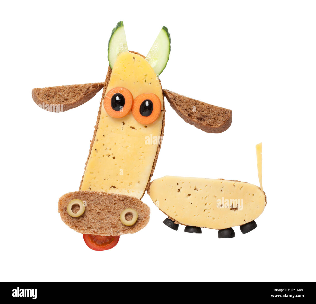 Cow made of black bread and cheese Stock Photo - Alamy