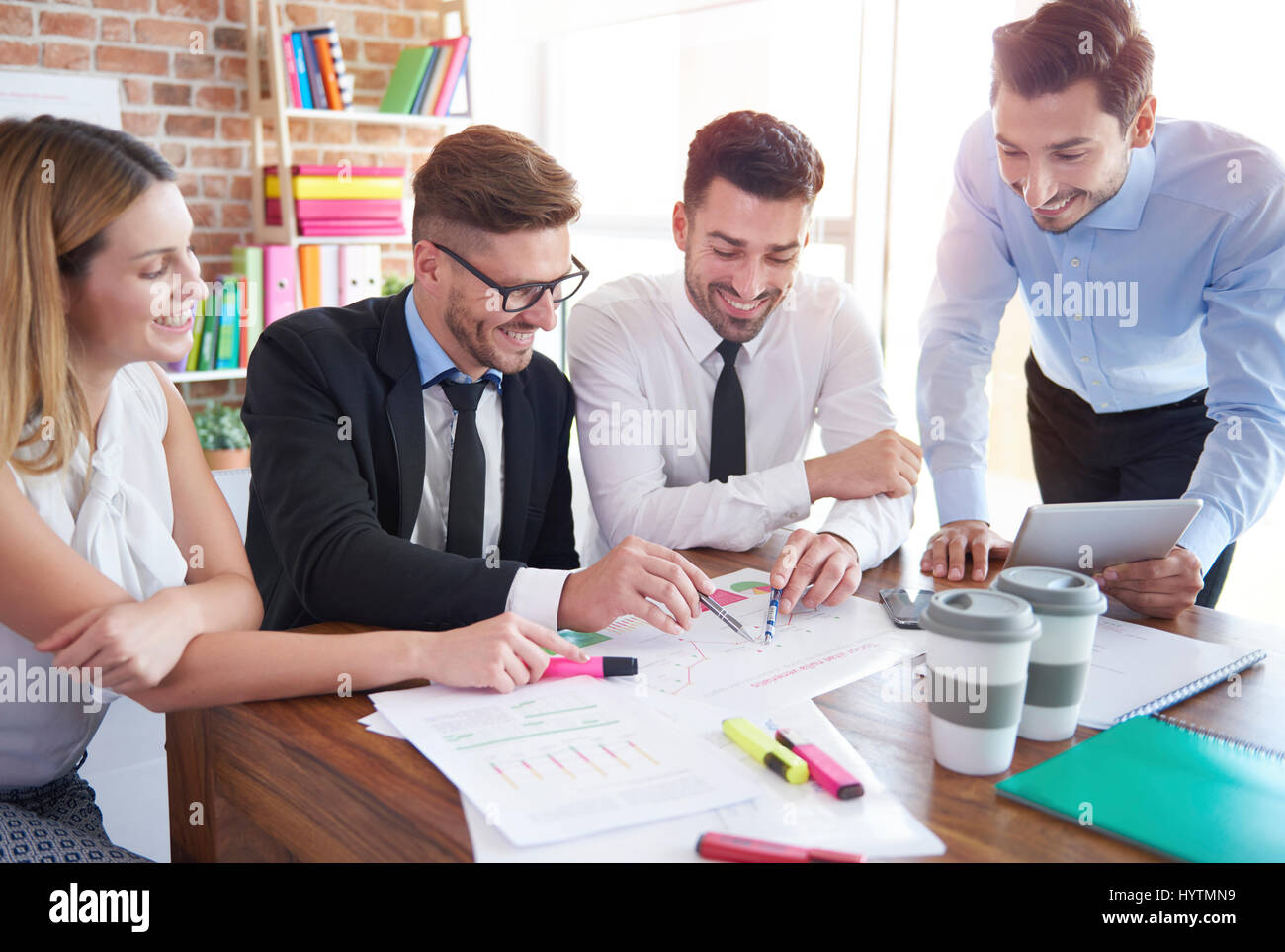 People gathered over the table Stock Photo - Alamy