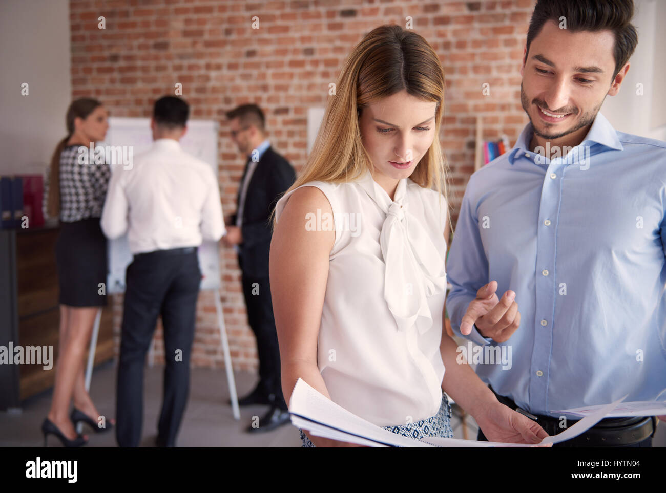 Everyone is busy in the company Stock Photo - Alamy