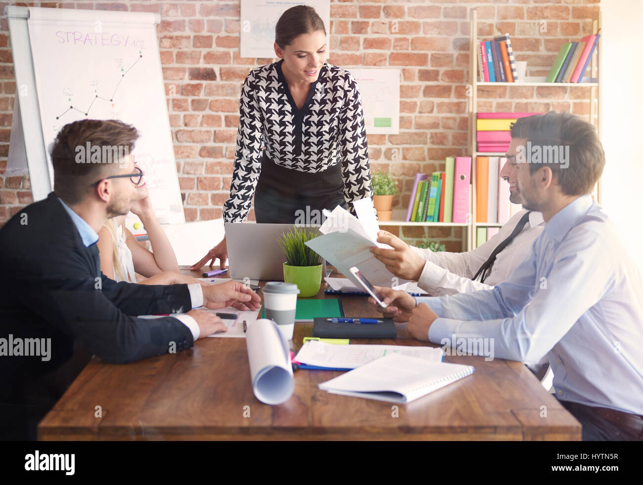 Boss leading the business meeting Stock Photo - Alamy