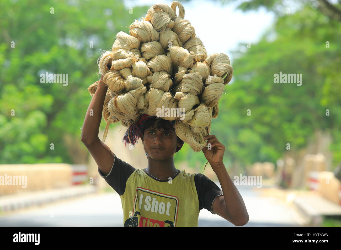 A man carry bundle of jute fibres at Gopalganj, Bangladesh Stock Photo ...