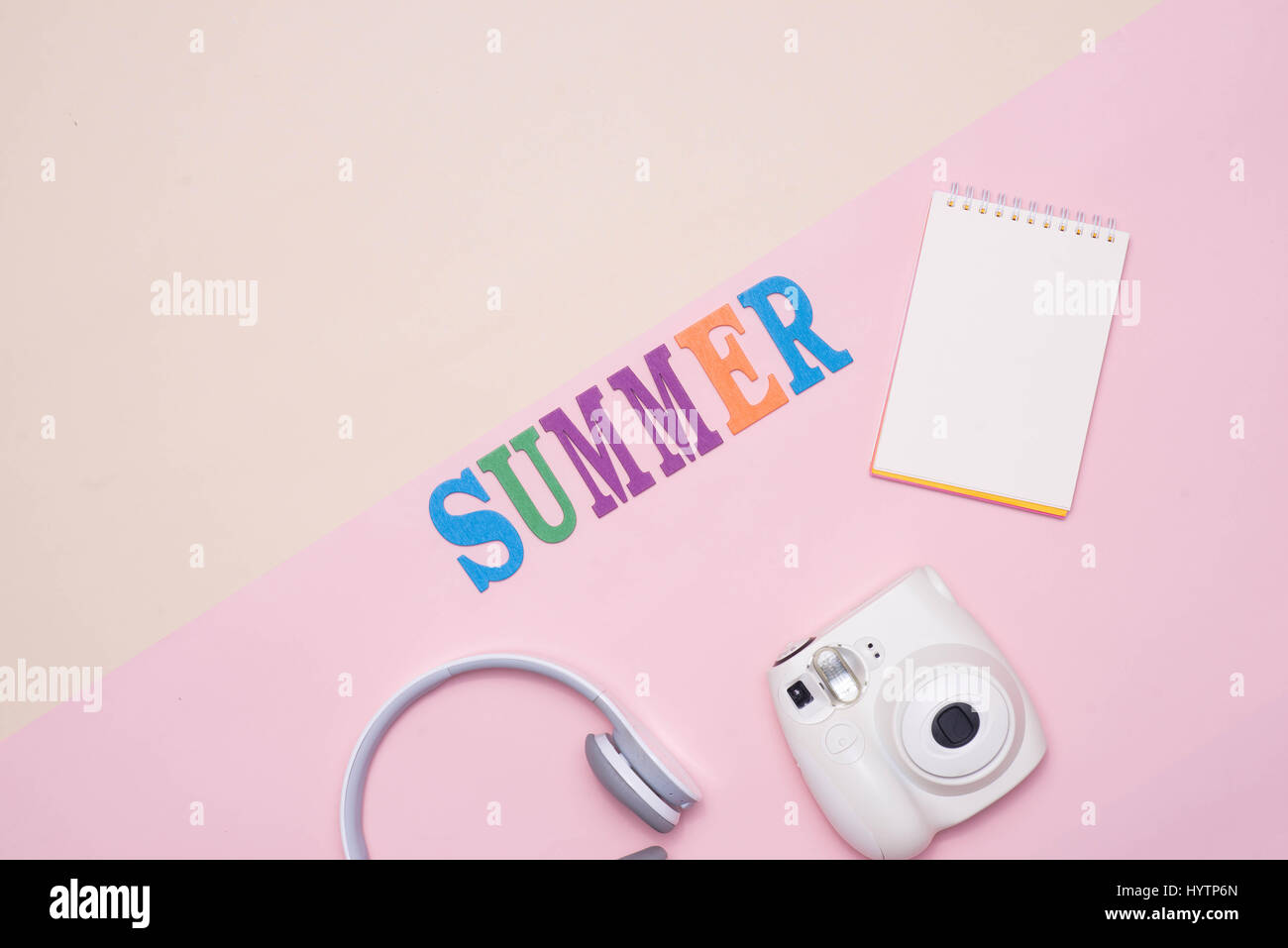 Summer fun written in colorful wooden letters on pastel color ...