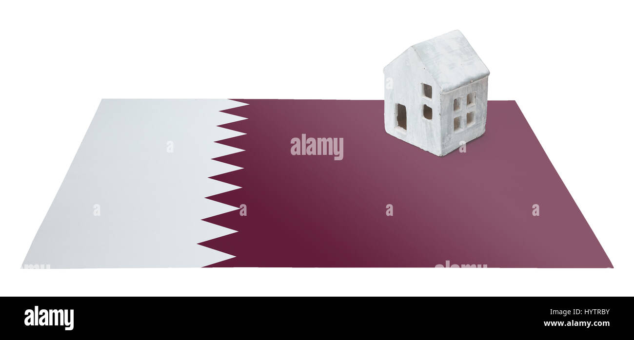 Small house on a flag - Living or migrating to Qatar Stock Photo - Alamy