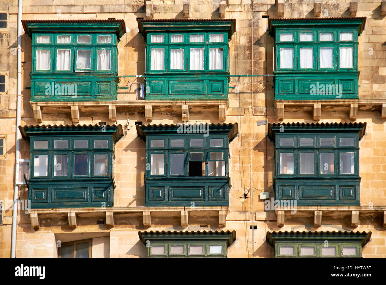 A traditional Maltese style different colored balconies in Valletta ...